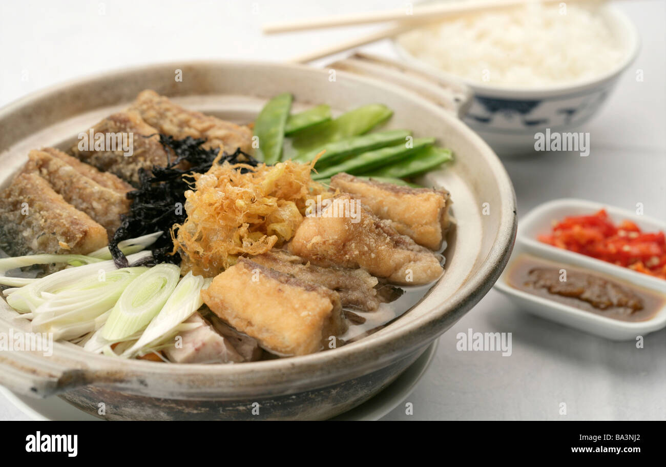 Vegetable fondue with bowl of rice and dip Stock Photo - Alamy