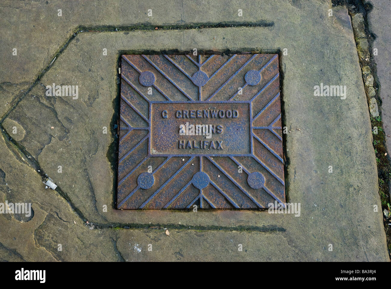 Coal plate in pavement, Halifax, Yorkshire Stock Photo - Alamy
