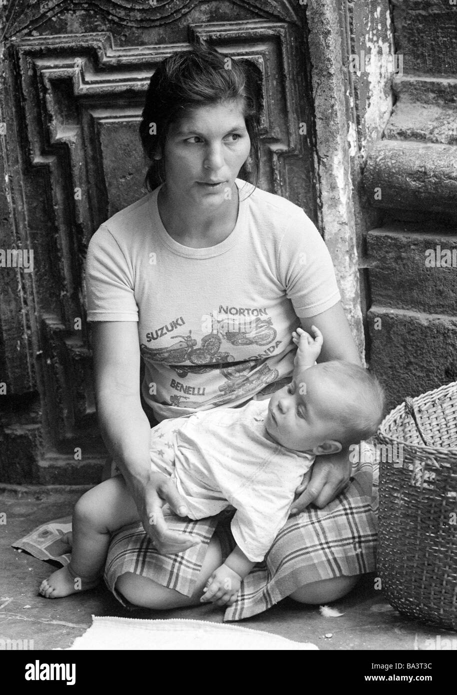 Seventies, black and white photo, people, poorness, beggar-woman sits ...