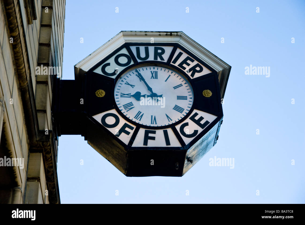Clock on the local Halifax newspaper offices, Yorkshire Stock Photo - Alamy