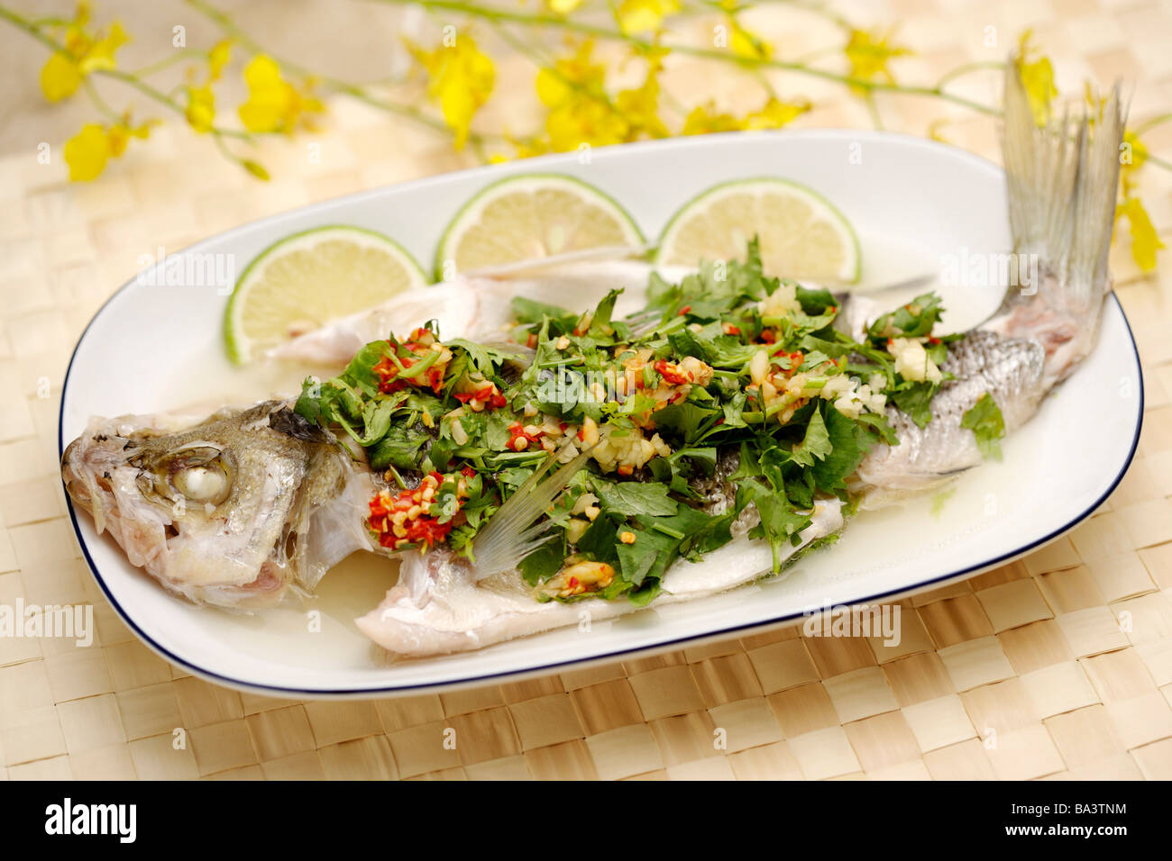 Steamed Fish With Lemon Sauce Stock Photo - Alamy