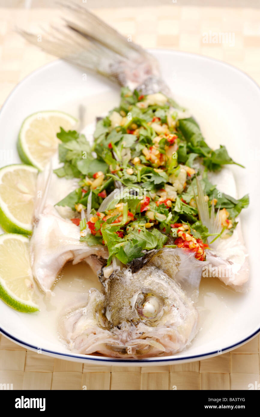 Steamed Fish With Lemon Sauce Stock Photo - Alamy