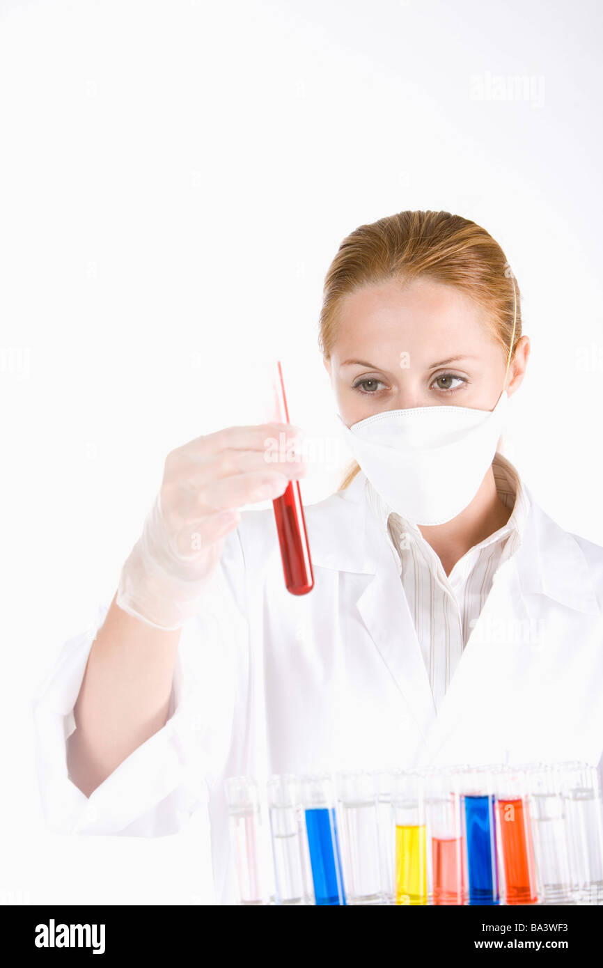 Female scientist holding test tube with liquid Stock Photo - Alamy