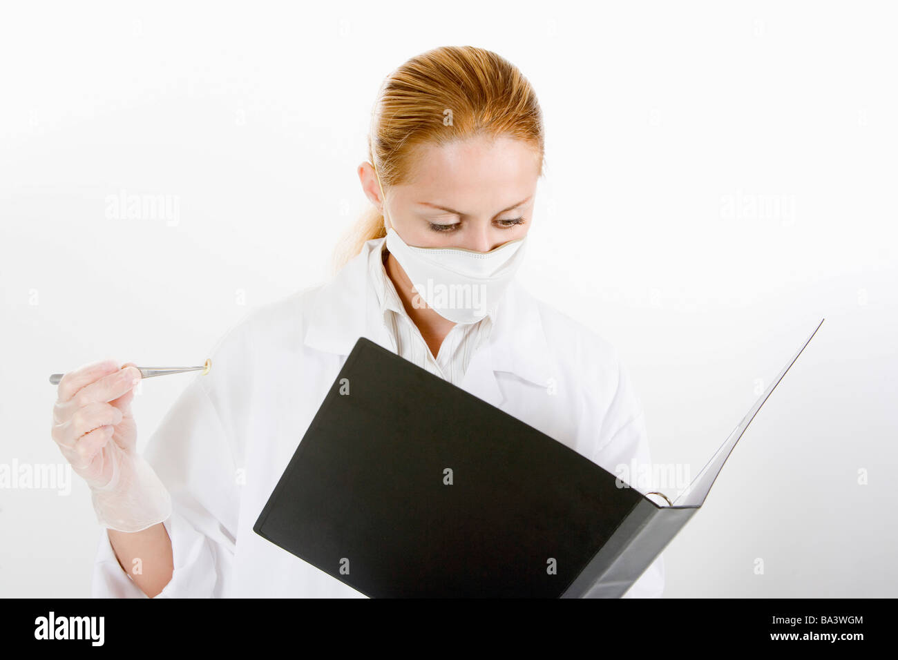 Female scientist looking at document portrait Stock Photo - Alamy