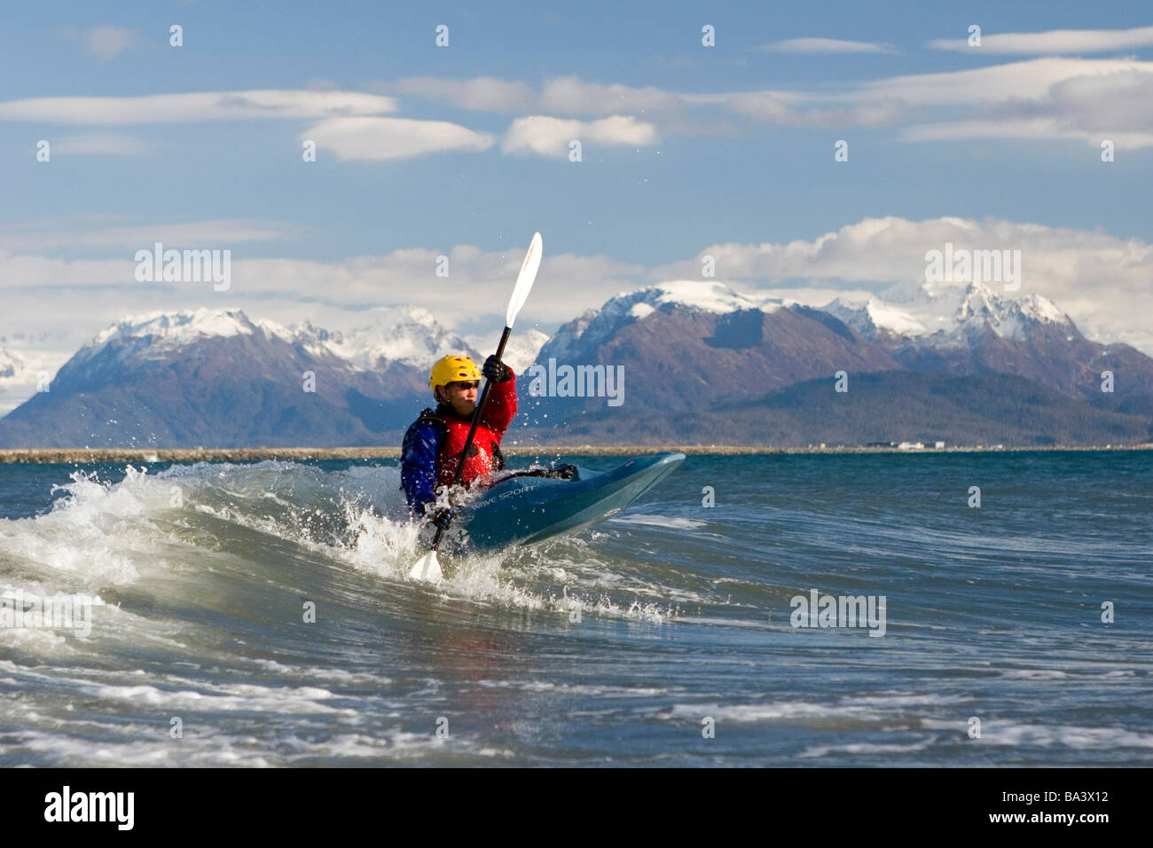 Man Kayak Surfing waves on Katchemak Bay near Homer Kenai Peninsula ...