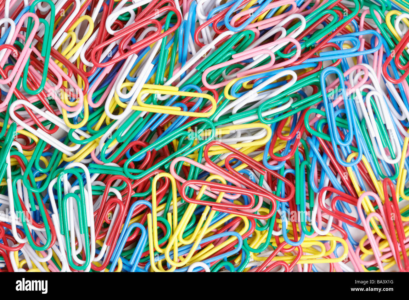 Stack of multi coloured paperclips close up full frame Stock Photo - Alamy