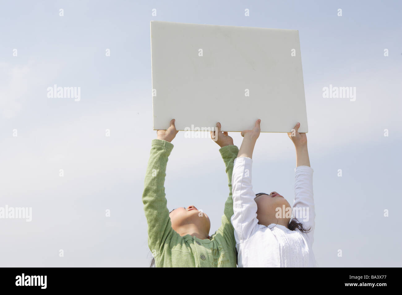 Children holding white cardboard Stock Photo - Alamy