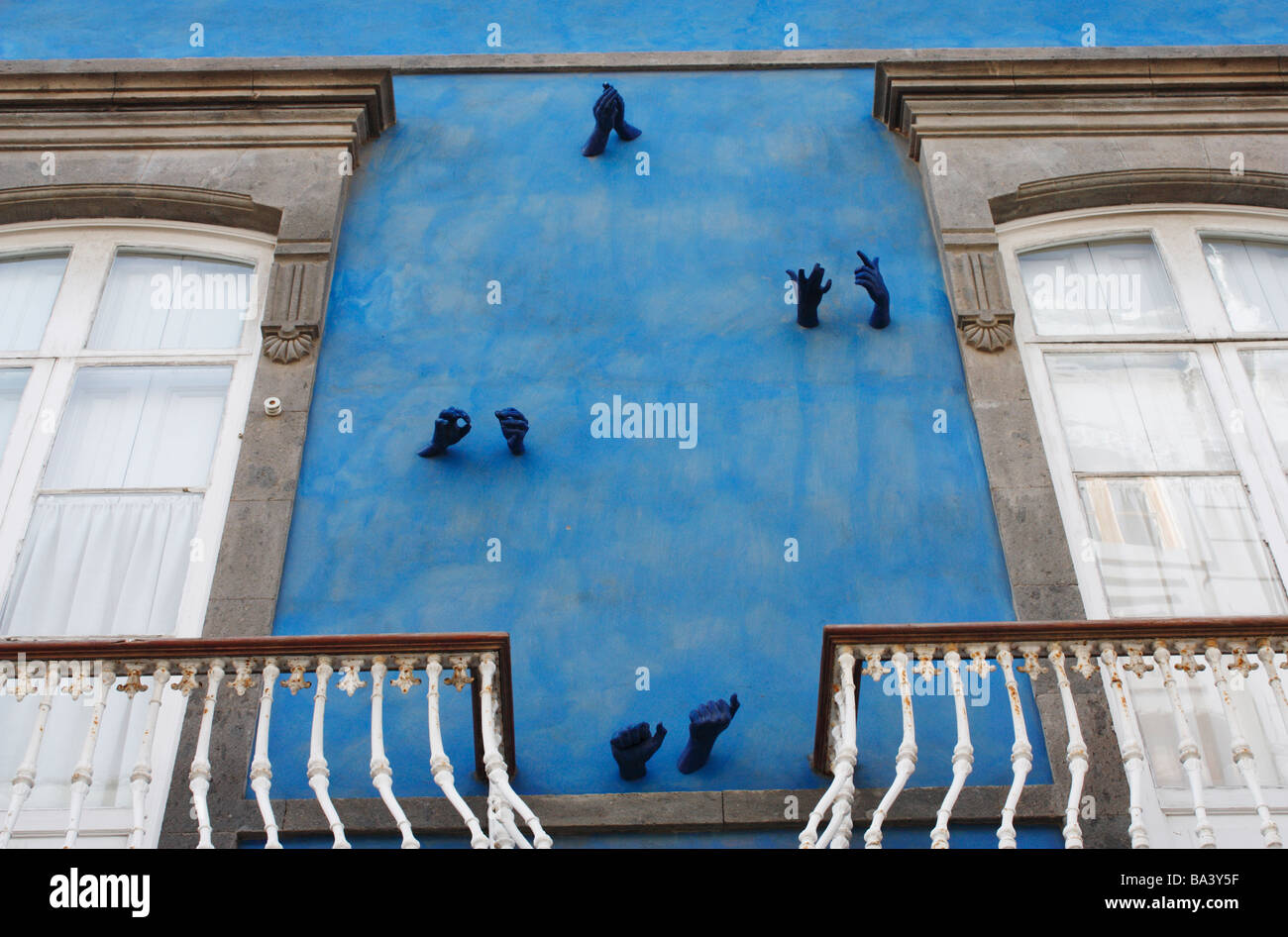 Hands coming out of wall on house in Spain Stock Photo - Alamy