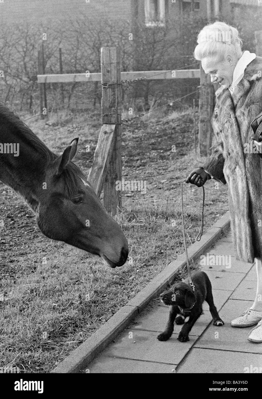 Woman stands near white Black and White Stock Photos & Images - Alamy