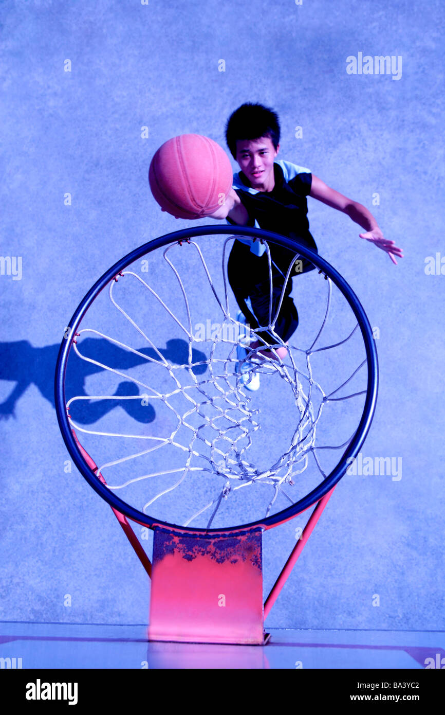 Teenage boy shooting a basketball high angle view Stock Photo - Alamy