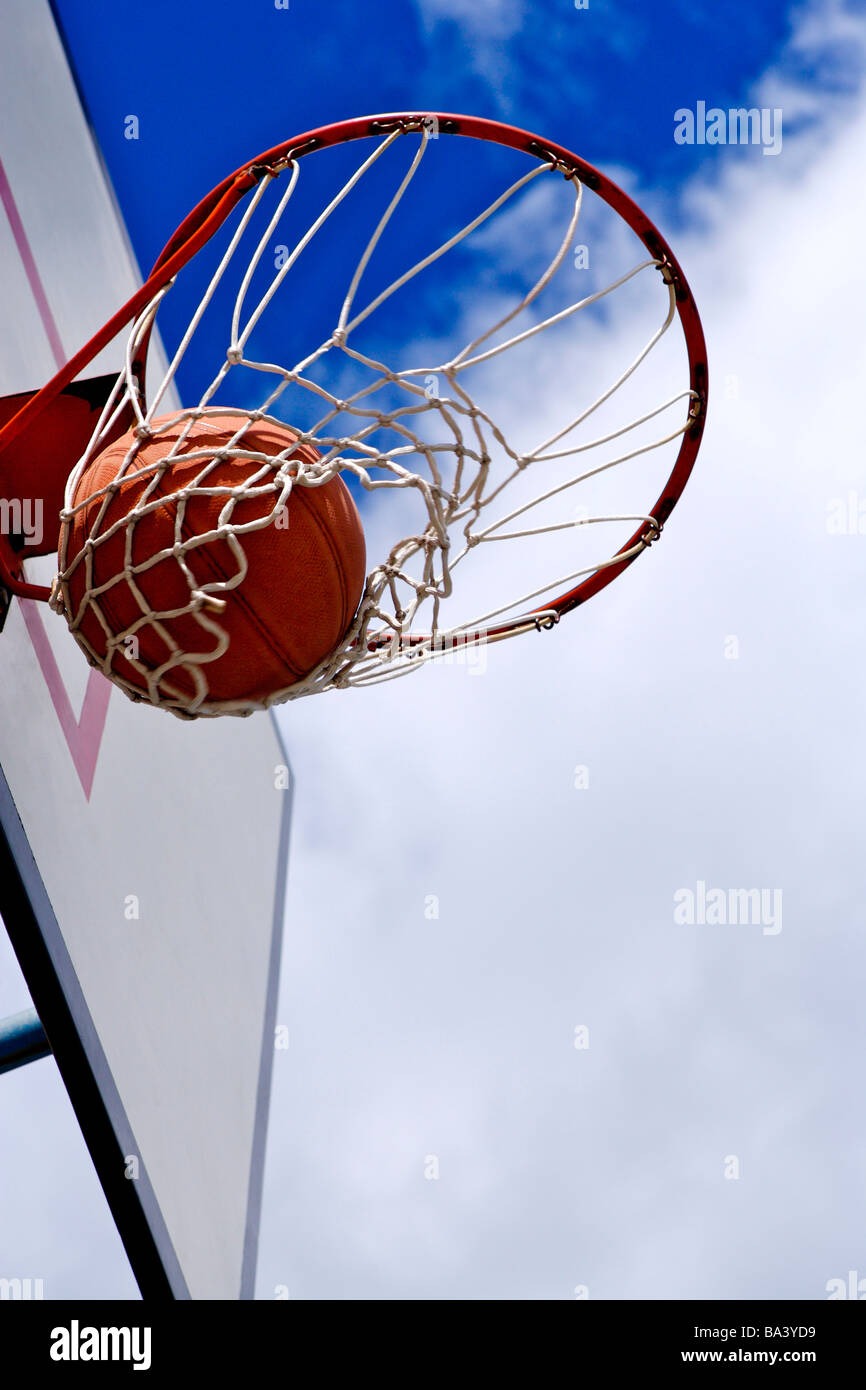 Basketball in hoop close up Stock Photo - Alamy