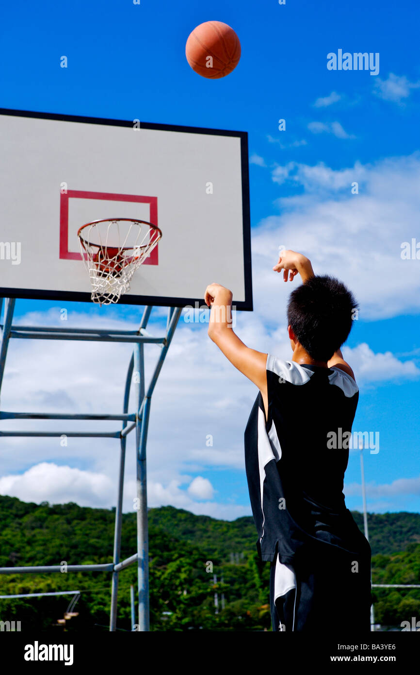 Teenage boy making a basket Stock Photo - Alamy