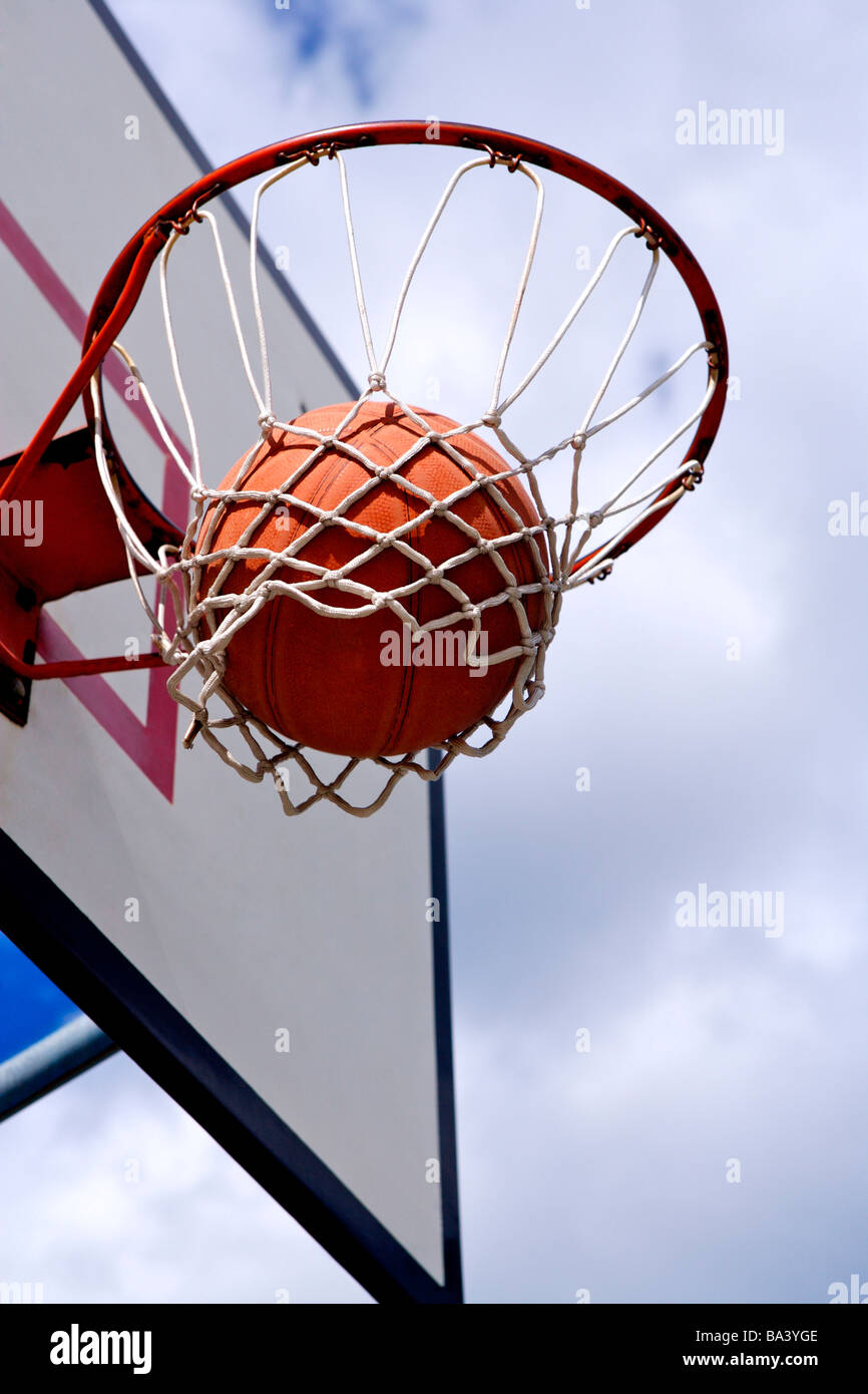 Basketball in hoop close up Stock Photo - Alamy