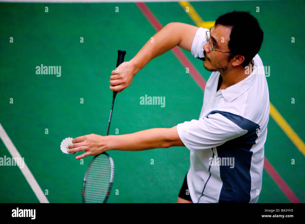 Badminton racket shuttlecock hitting hi-res stock photography and ...