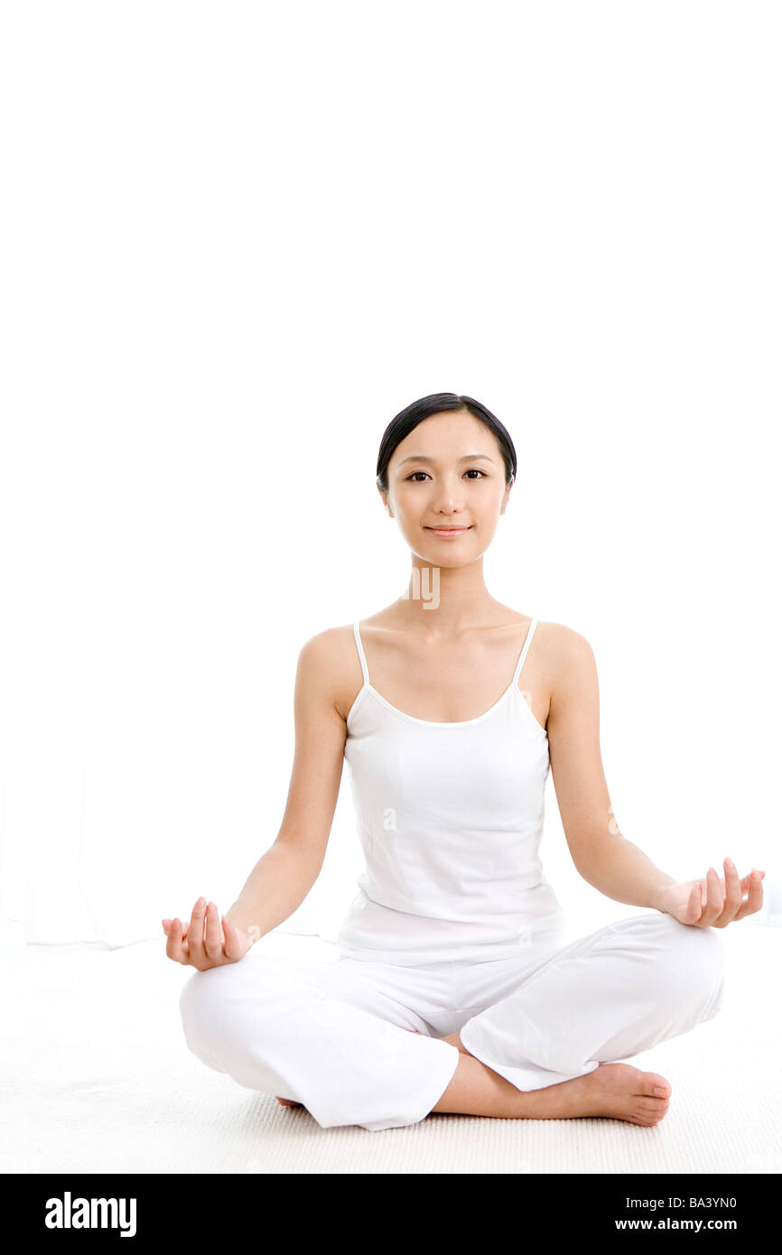 Young woman in lotus position Stock Photo - Alamy