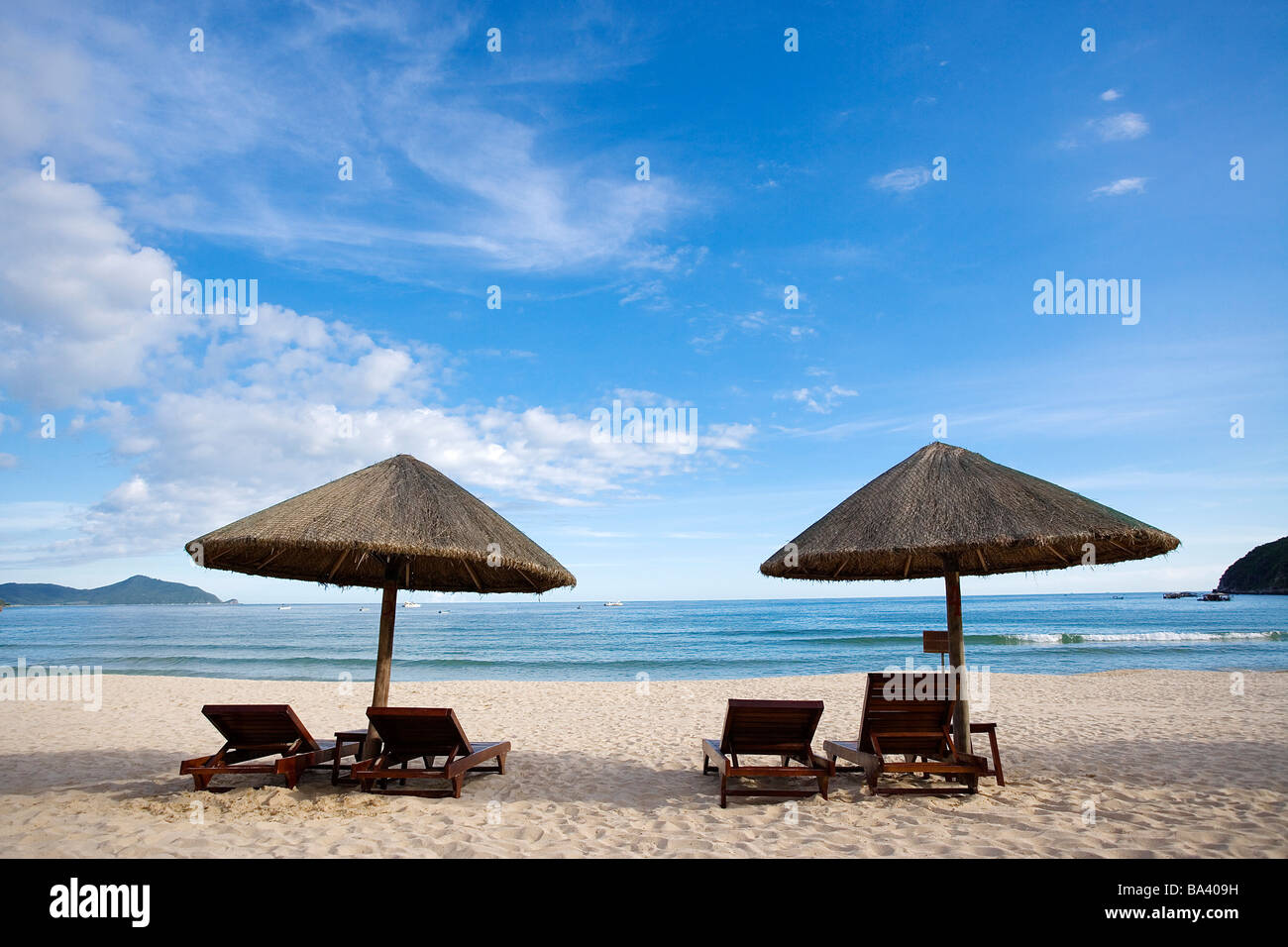 Beach chairs and umbrellas on beach Dadong Sea Hainan Province Stock ...