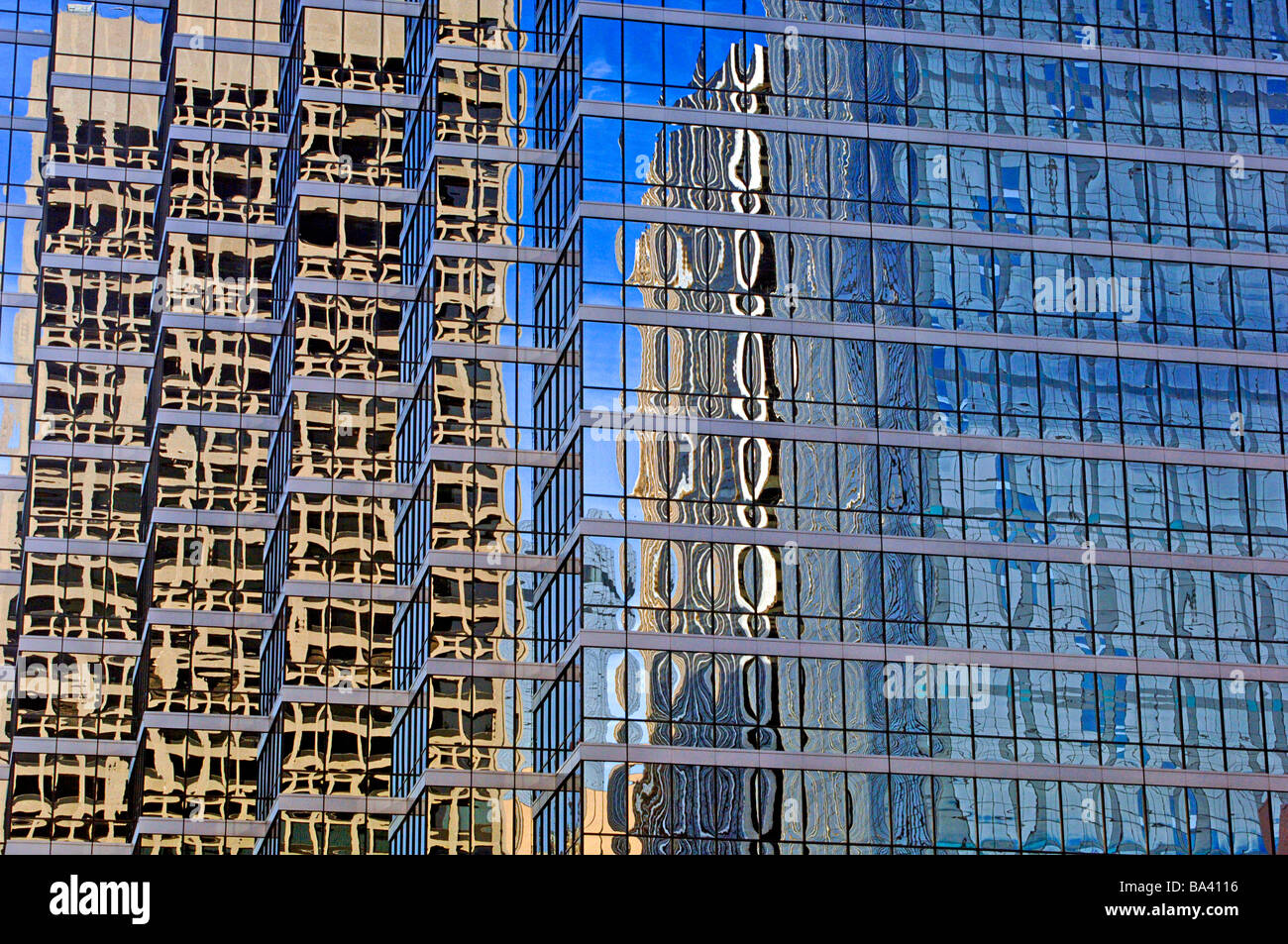 Modern glass high rise building with vibrant colorful reflections of ...