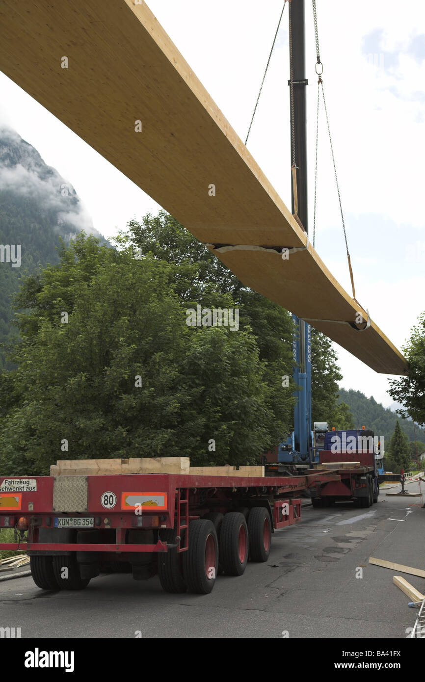 Construction works lift street truck crane-arm wood-bearers building ...