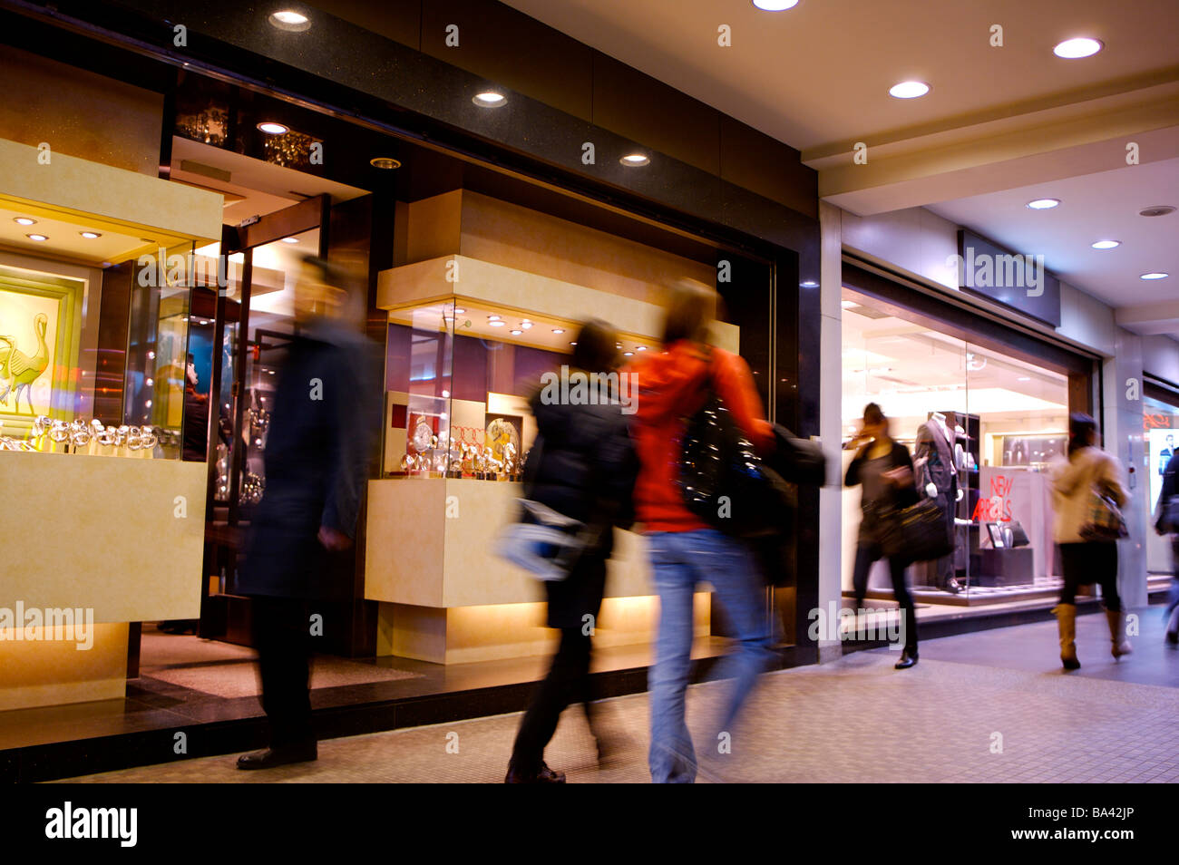 People shopping in shopping mall Stock Photo - Alamy