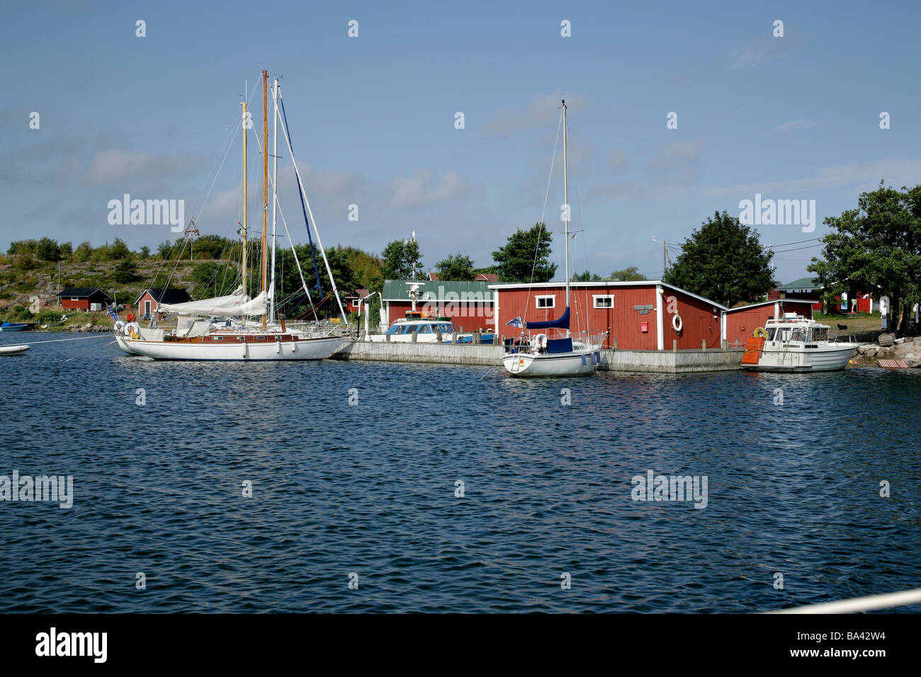 serene afternoon in small fishing harbor in archipelago Stock Photo - Alamy
