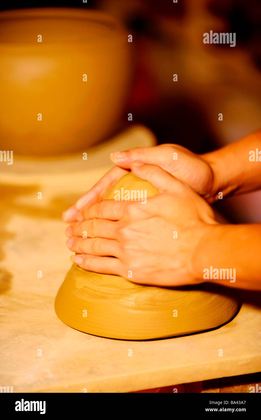 Hands of potter at work throwing pot Stock Photo - Alamy