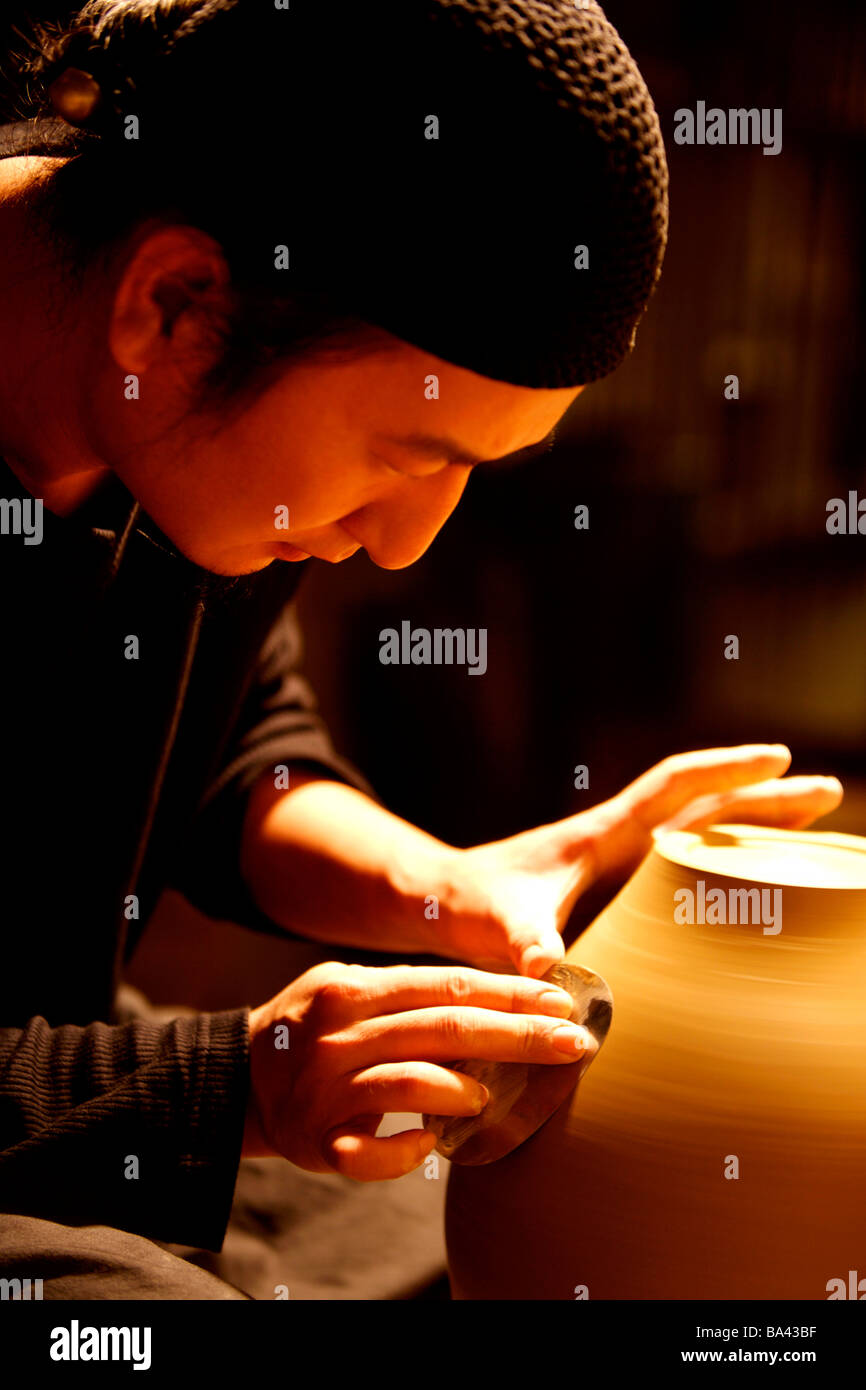 Potter molding clay side view Stock Photo - Alamy