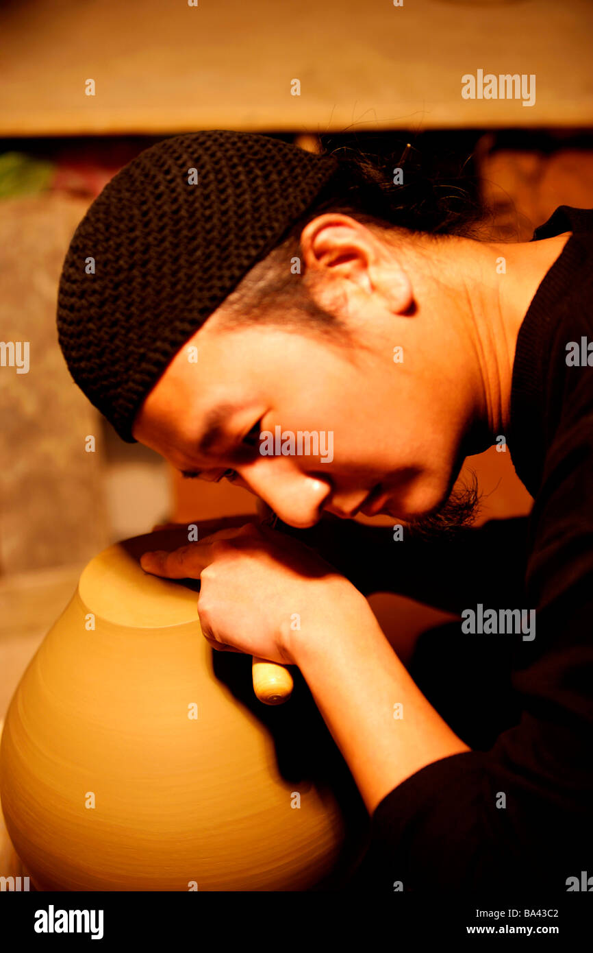 Potter listening pottery s sound side view Stock Photo - Alamy