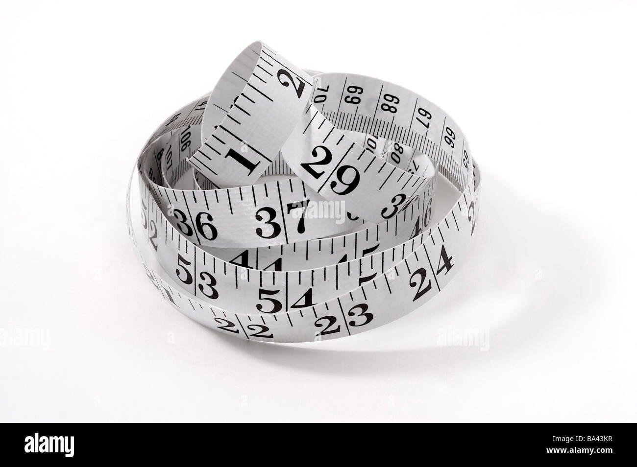 Twisted tape measure Stock Photo - Alamy
