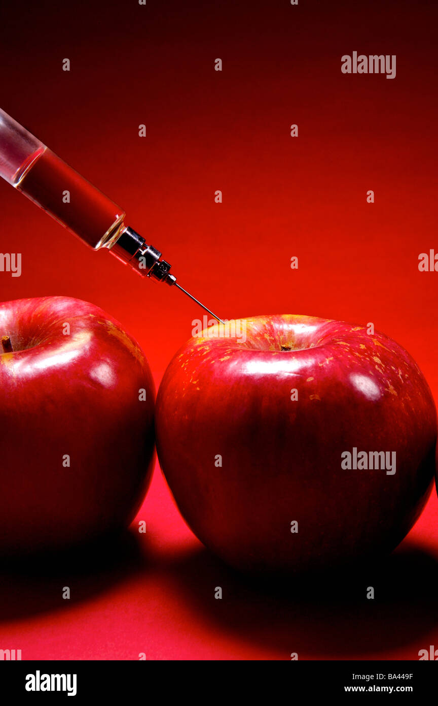 Apple being injected by syringe Stock Photo - Alamy
