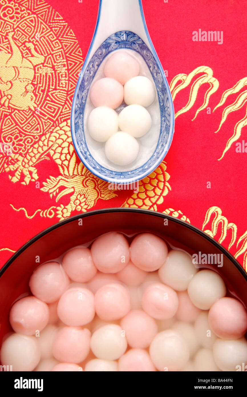 Dumplings in spoon and a bowl of dumplings Stock Photo - Alamy