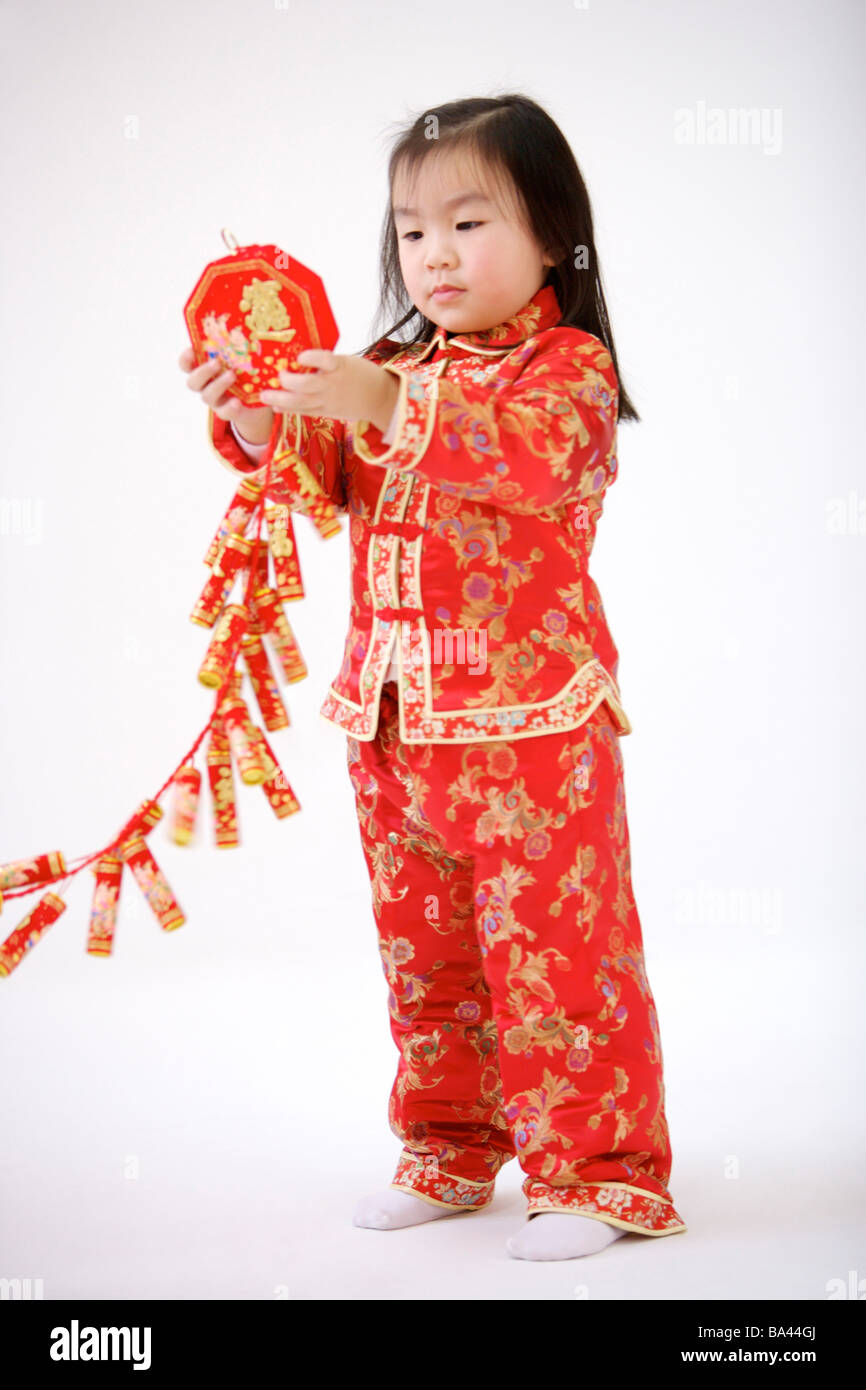 Girl holding firecrackers hi-res stock photography and images - Alamy
