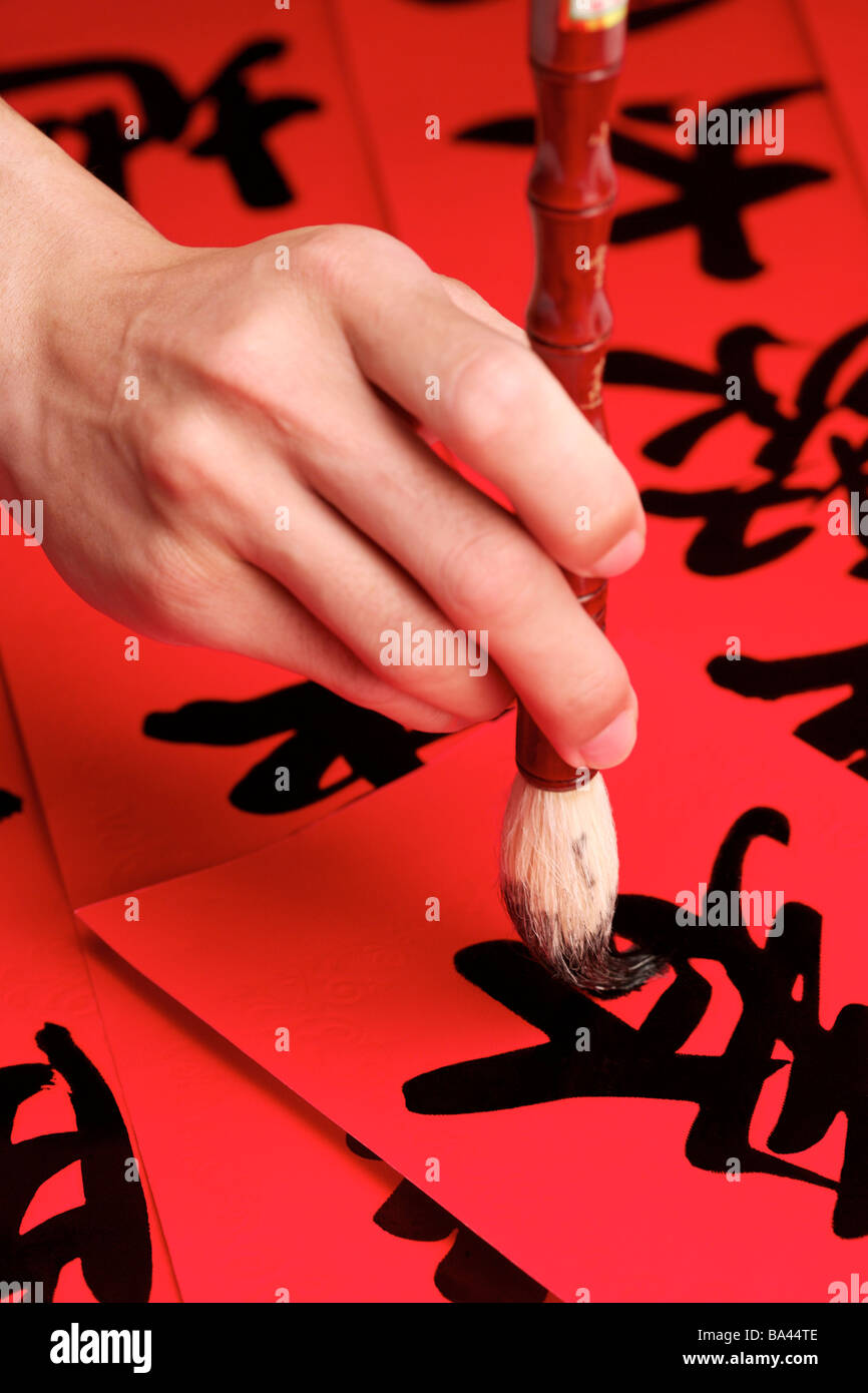 Close up of hand writing chinese script Stock Photo - Alamy