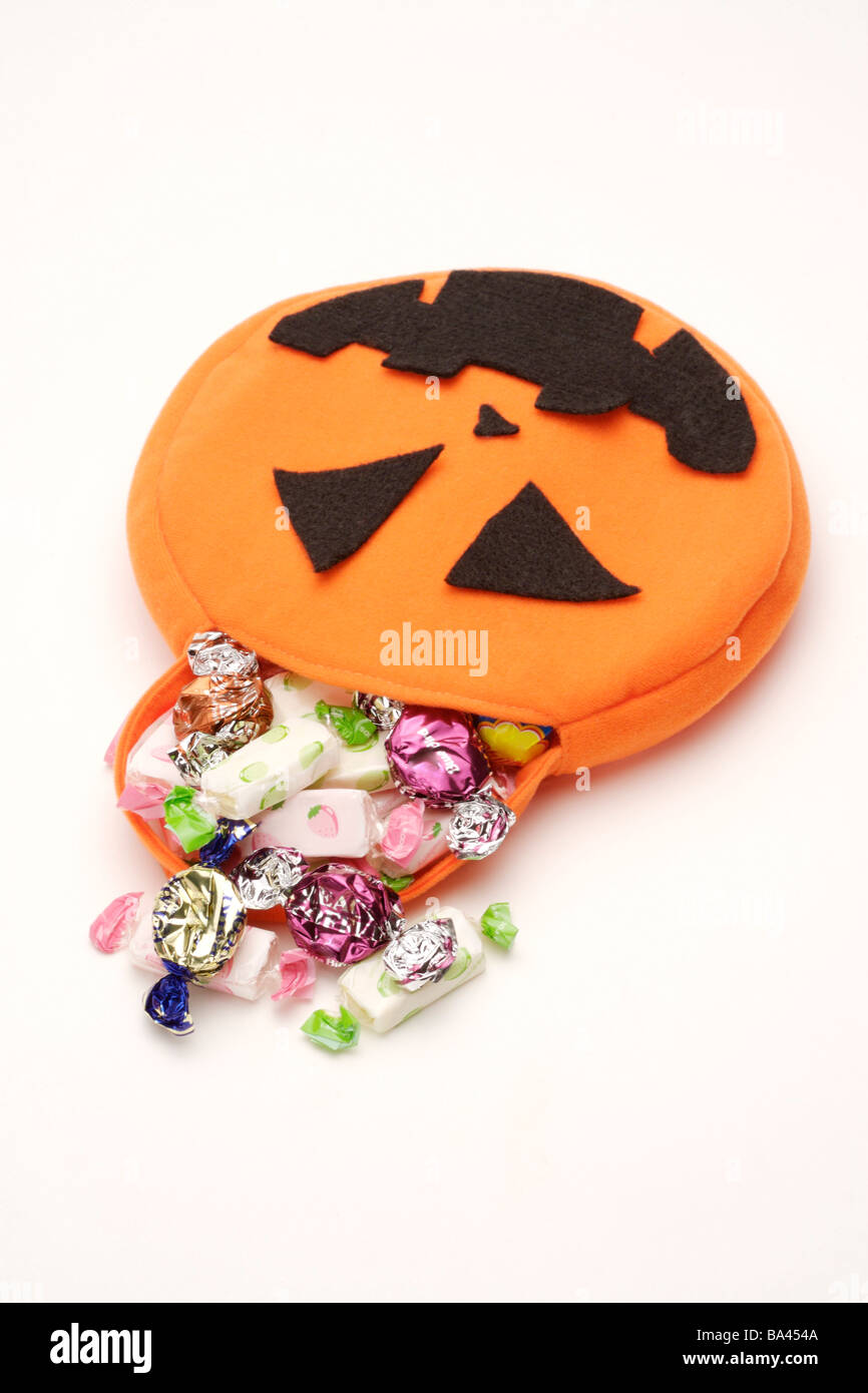 Candies spilling out of box Stock Photo - Alamy