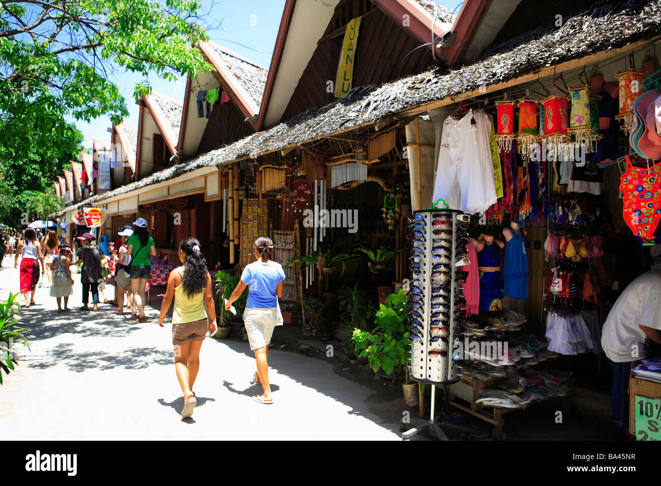 Shops on the right side of street Stock Photo - Alamy