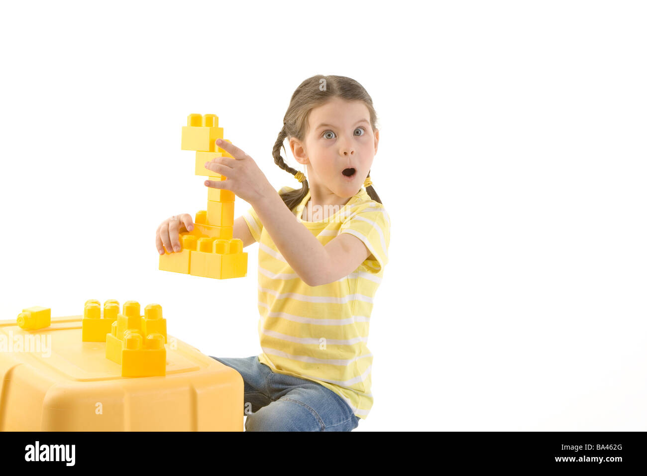 girl playing bricks Stock Photo - Alamy