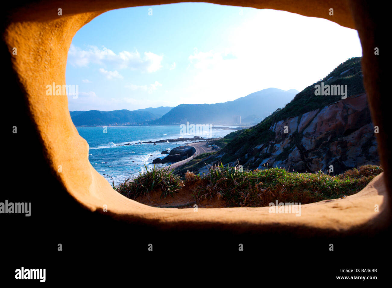 Beach scene from hole of a rock Stock Photo - Alamy