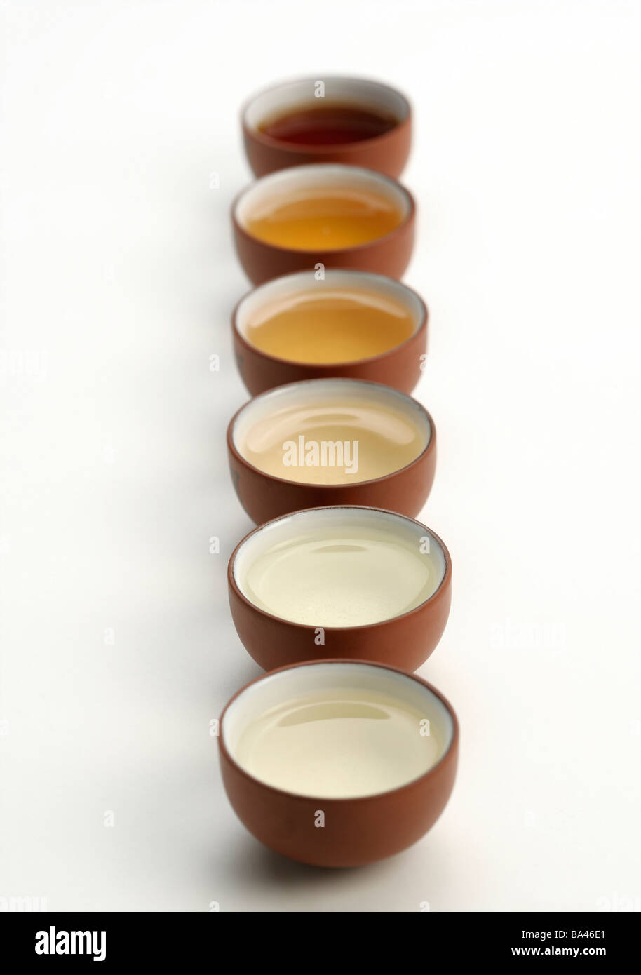 Cups of tea in a line Stock Photo - Alamy