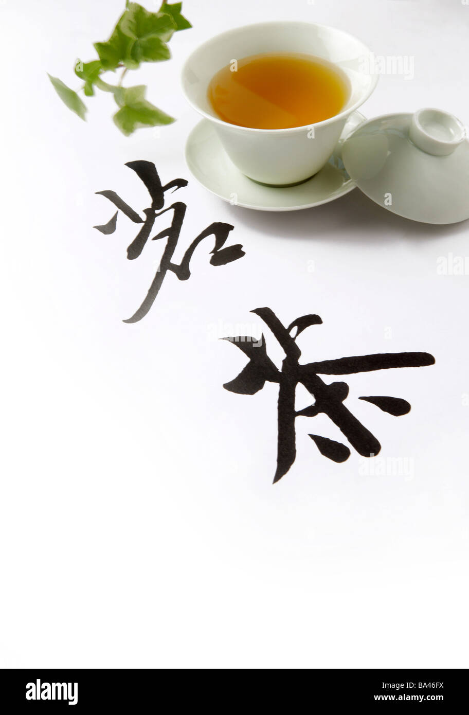 Cup of tea on Chinese character painting high angle view Stock Photo ...