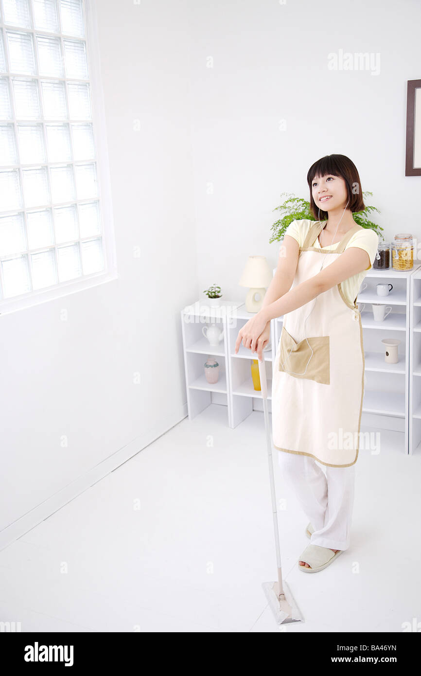 Young woman mopping smiling Stock Photo - Alamy