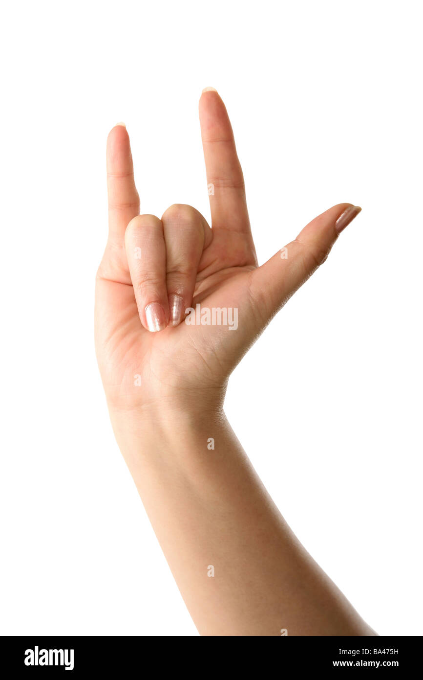 Woman making hand gesture of rock and roll Stock Photo - Alamy