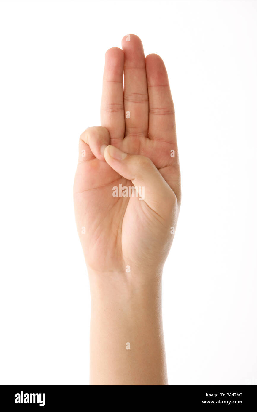 Man s hand making a vow with three fingers up Stock Photo - Alamy