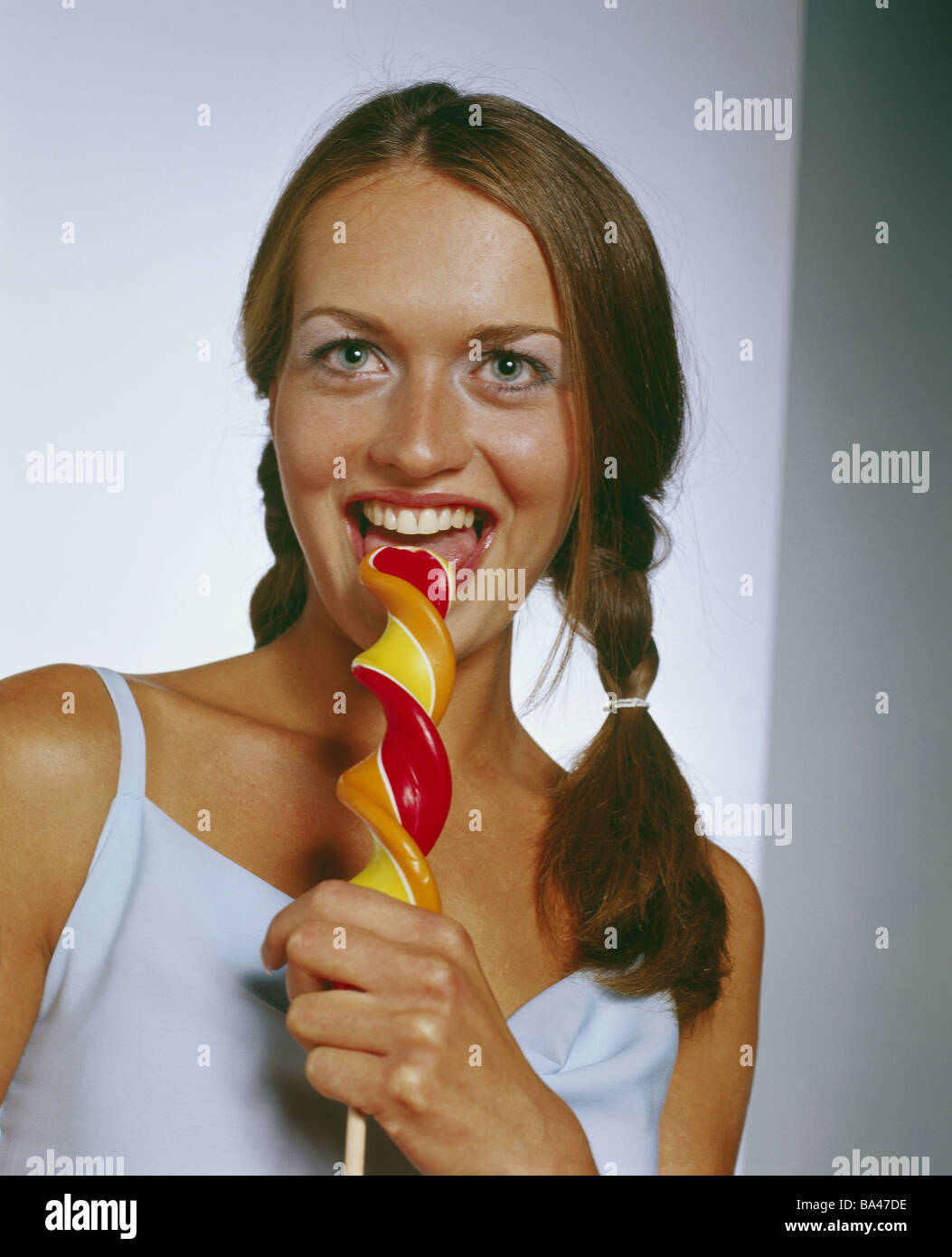 Woman young lollipops eats cheerfully portrait people 20-30 years 30-40 ...