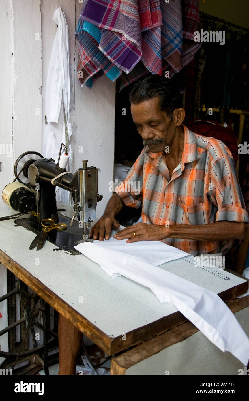 Local Indian man sewing outside his shop on Jew Town Road, Mattancherry ...