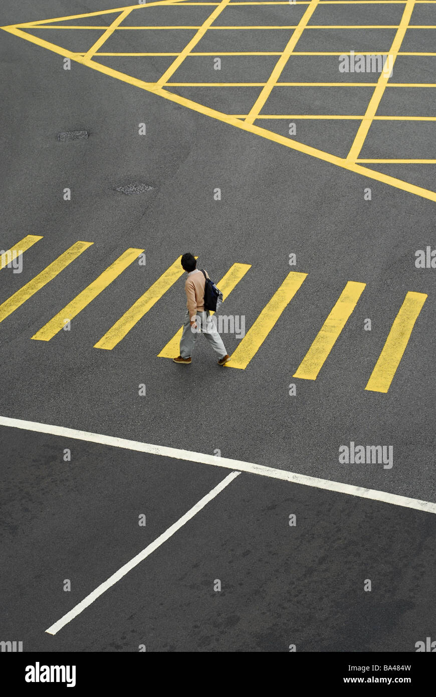 Crosswalks passer-by man roadway marking Asia China Hong Kong 03/2006 ...