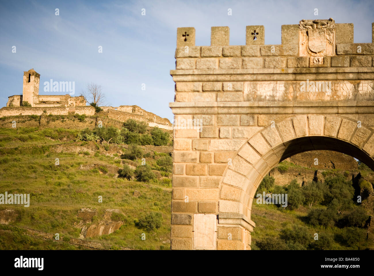 Alcantara bridge triumphal arch with Las Monjas convent on the ...