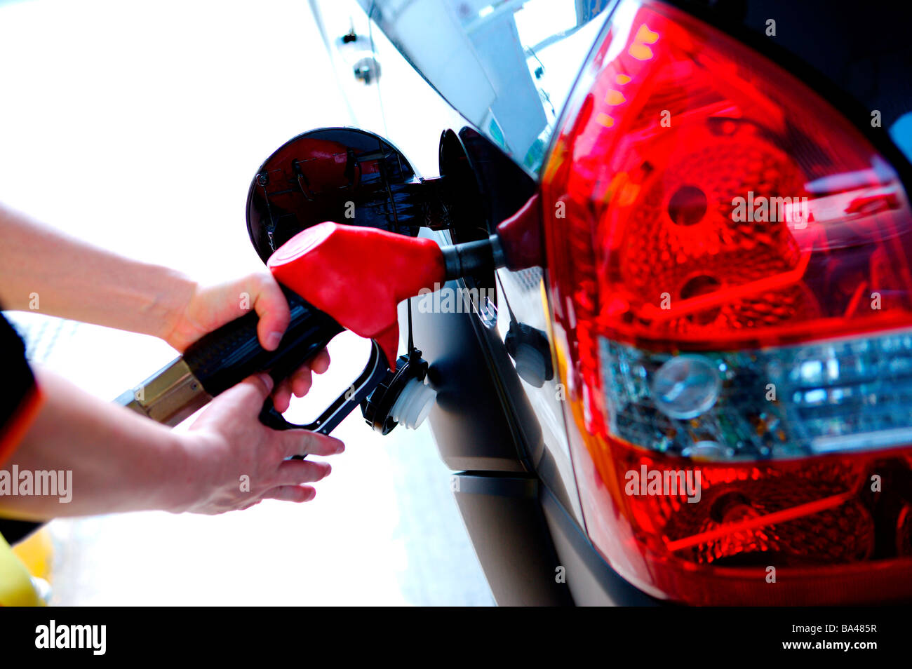 Man pumping gas Stock Photo - Alamy