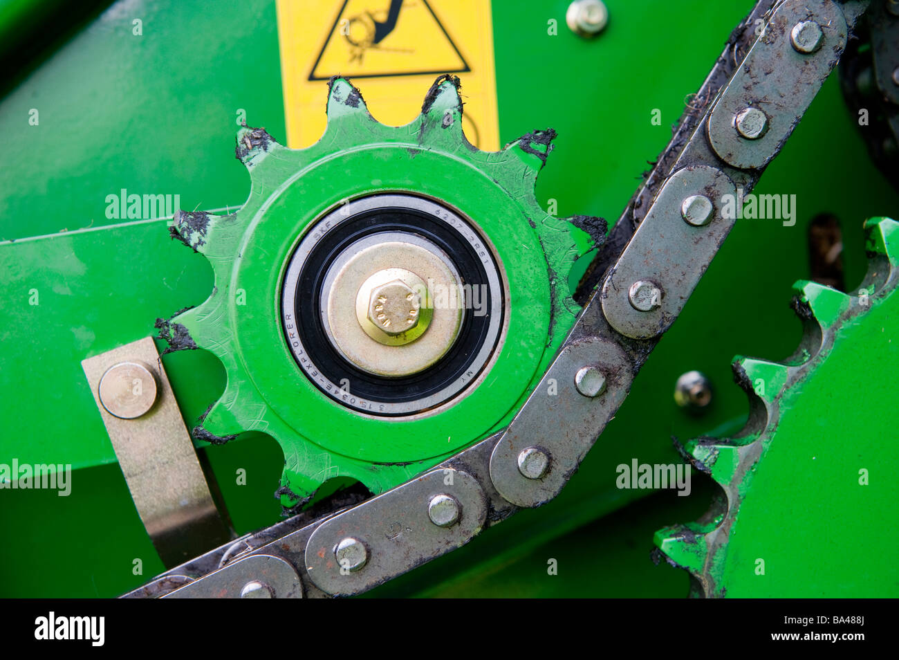 Gears cogs and chains inside a big baler Stock Photo - Alamy