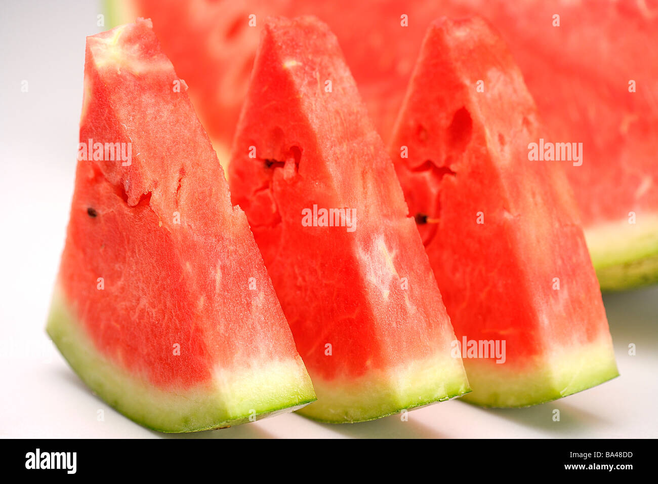 Three watermelon wedges and slice Stock Photo - Alamy