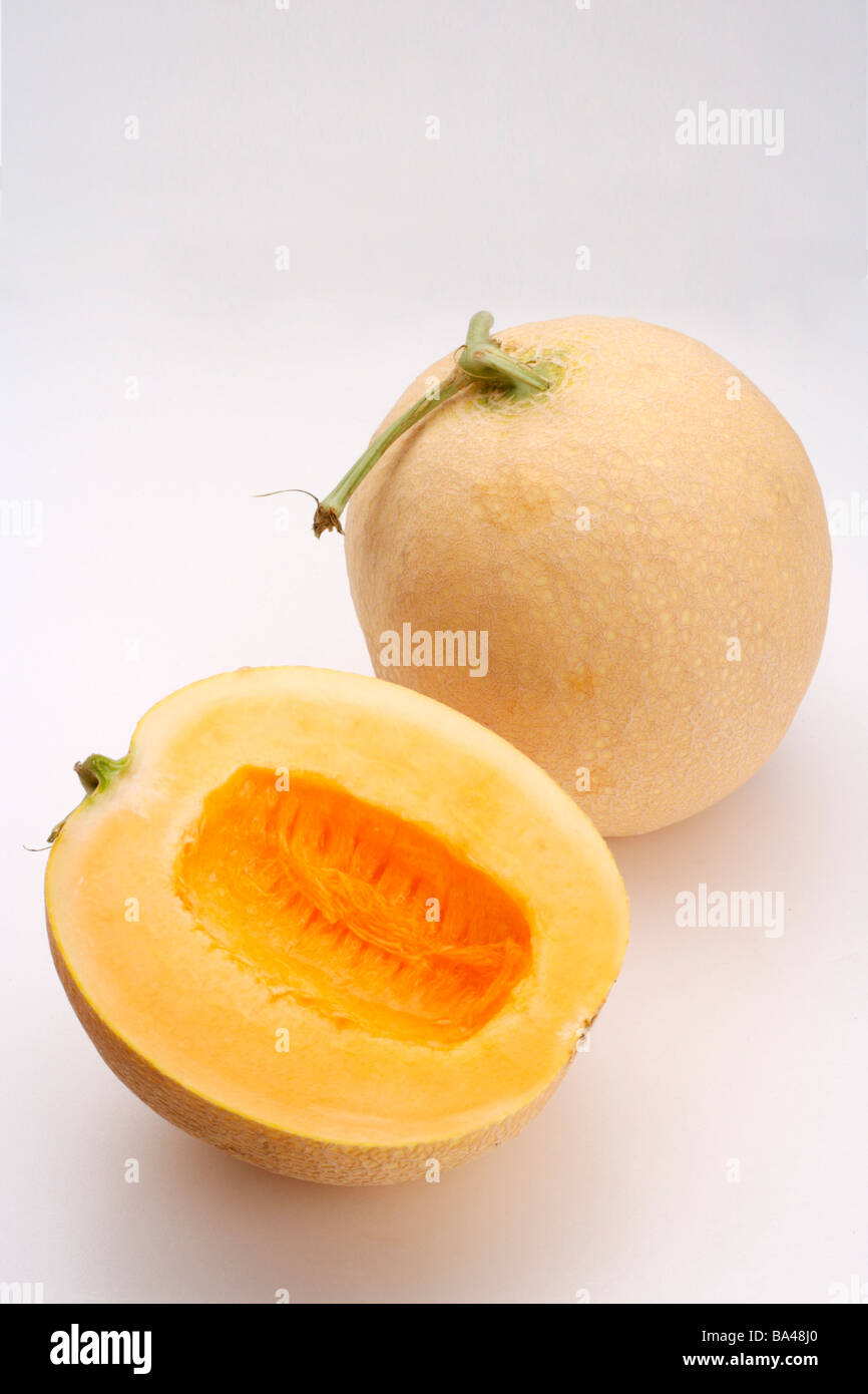Halved and whole melon Stock Photo - Alamy