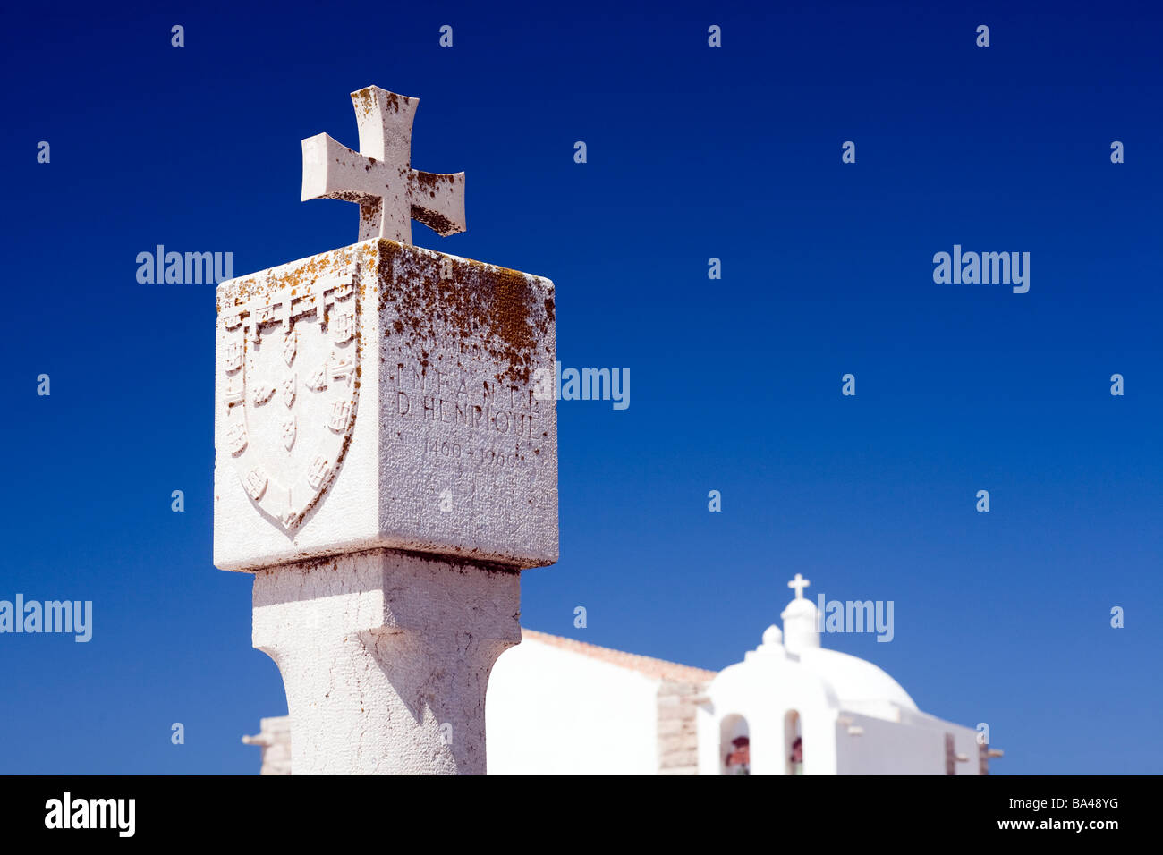 Stone cross with the Portuguese national emblem and Nossa Senhora da ...